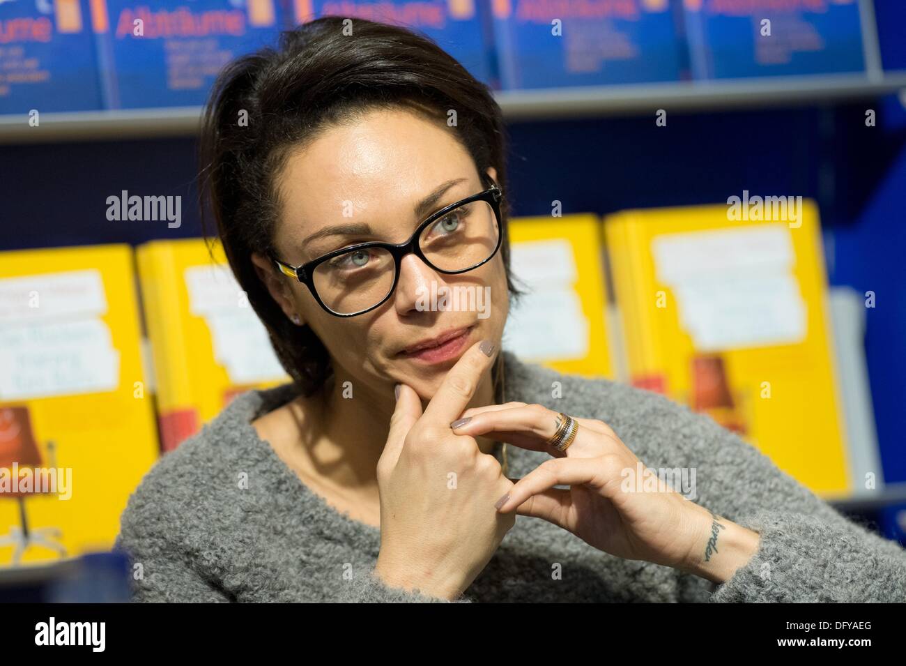 Frankfurt, Germany. 10th Oct, 2013. Lilly Becker follows the book ...