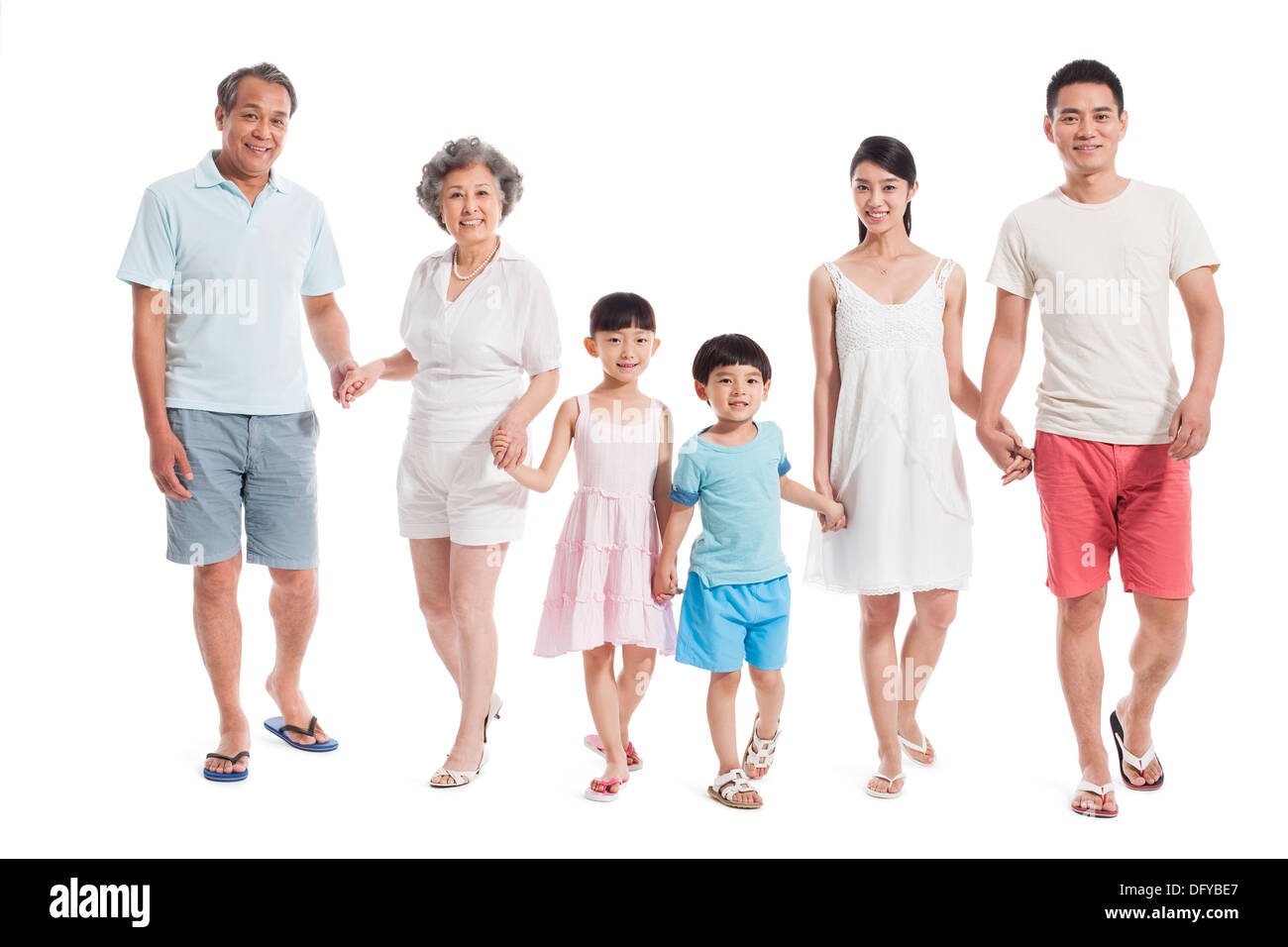 Happy family holding hands Stock Photo - Alamy