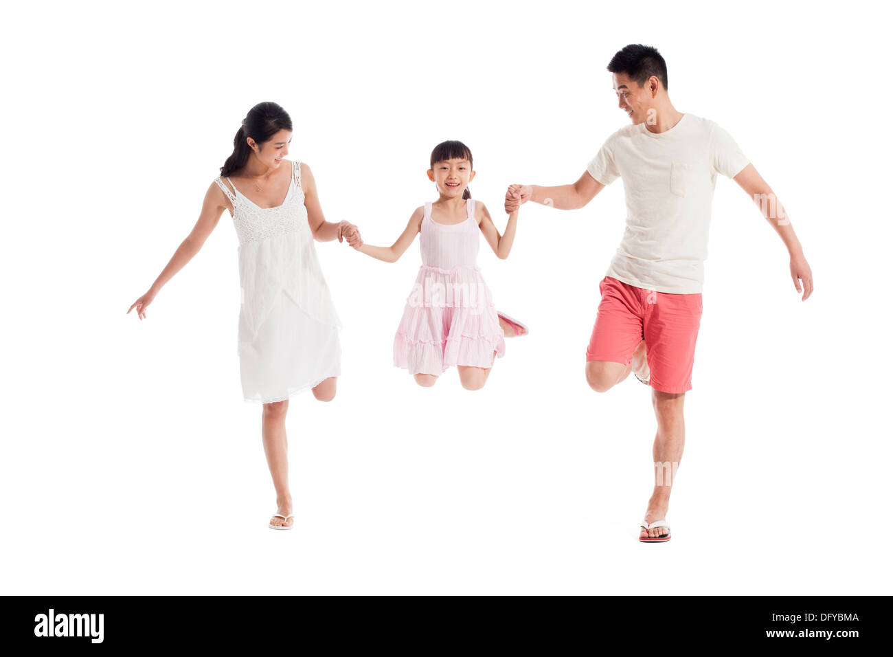 Happy family jumping Stock Photo - Alamy