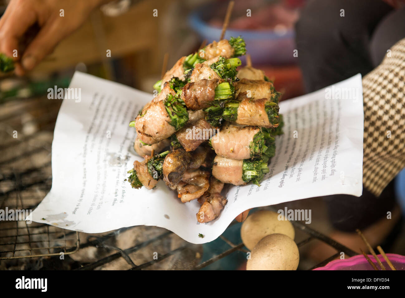 Local people enjoy the pork intestines with spring onion cook by grill ...