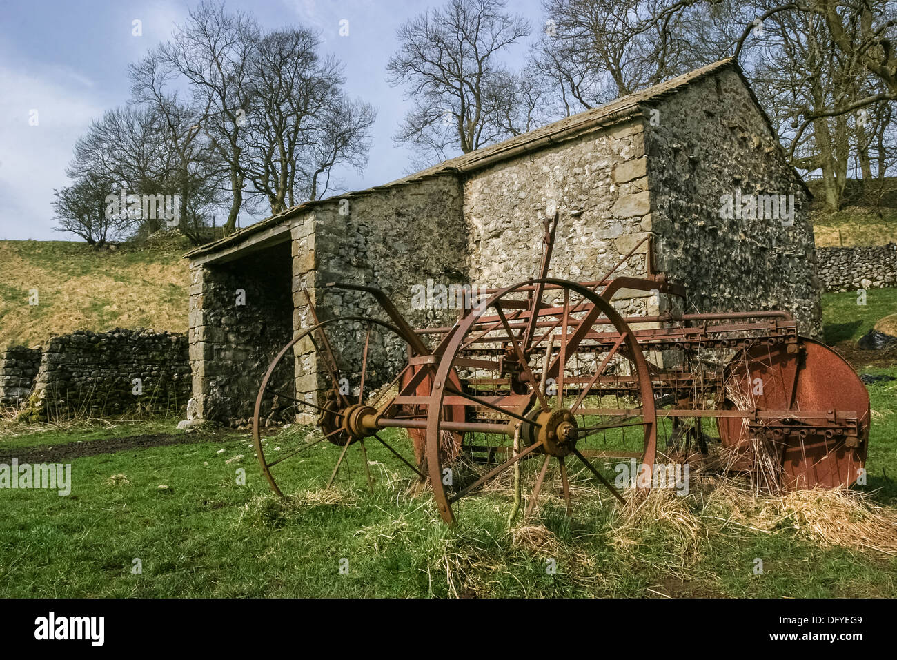 Barn and rusty farm machinery, Yorkshire Dales National Park, England ...