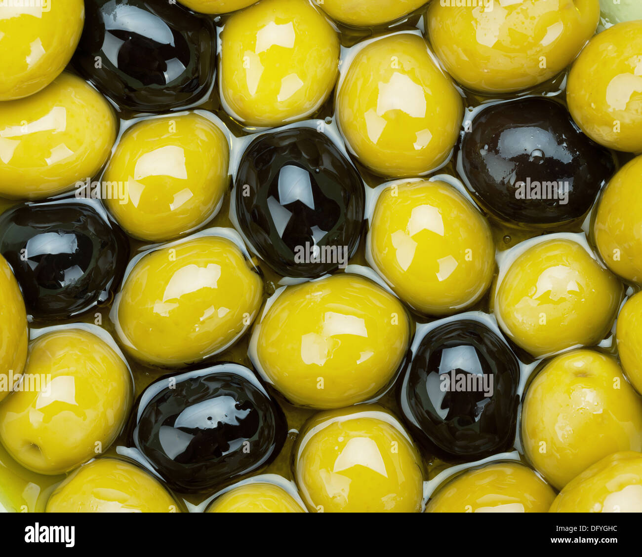 Green and black olives texture food background Stock Photo - Alamy