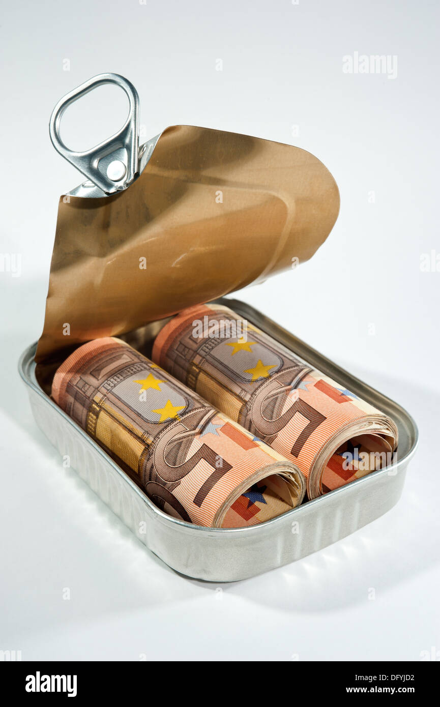 Tin can with money Stock Photo - Alamy