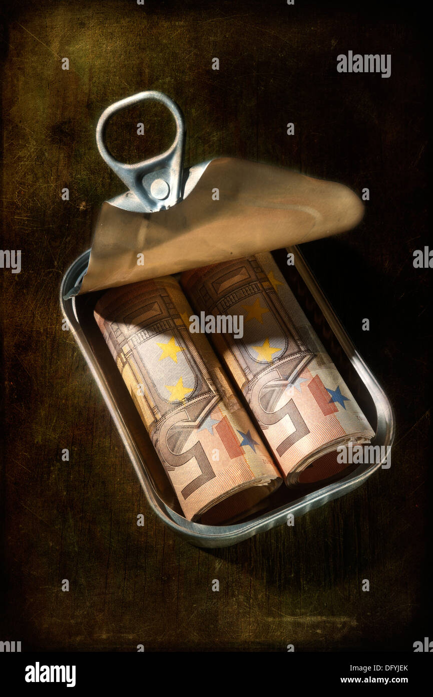 Tin can with money Stock Photo - Alamy