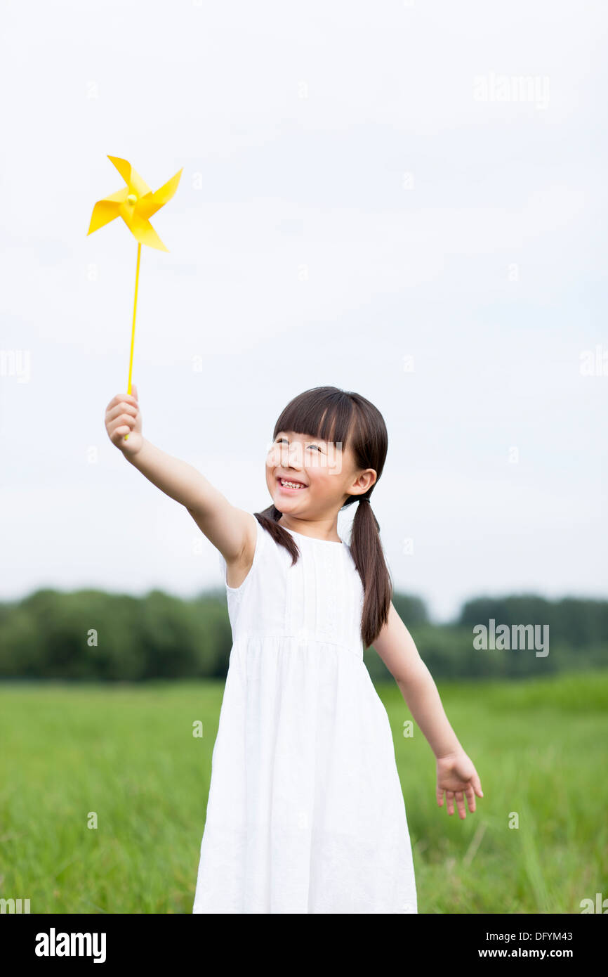Girl holding windmill hi-res stock photography and images - Alamy