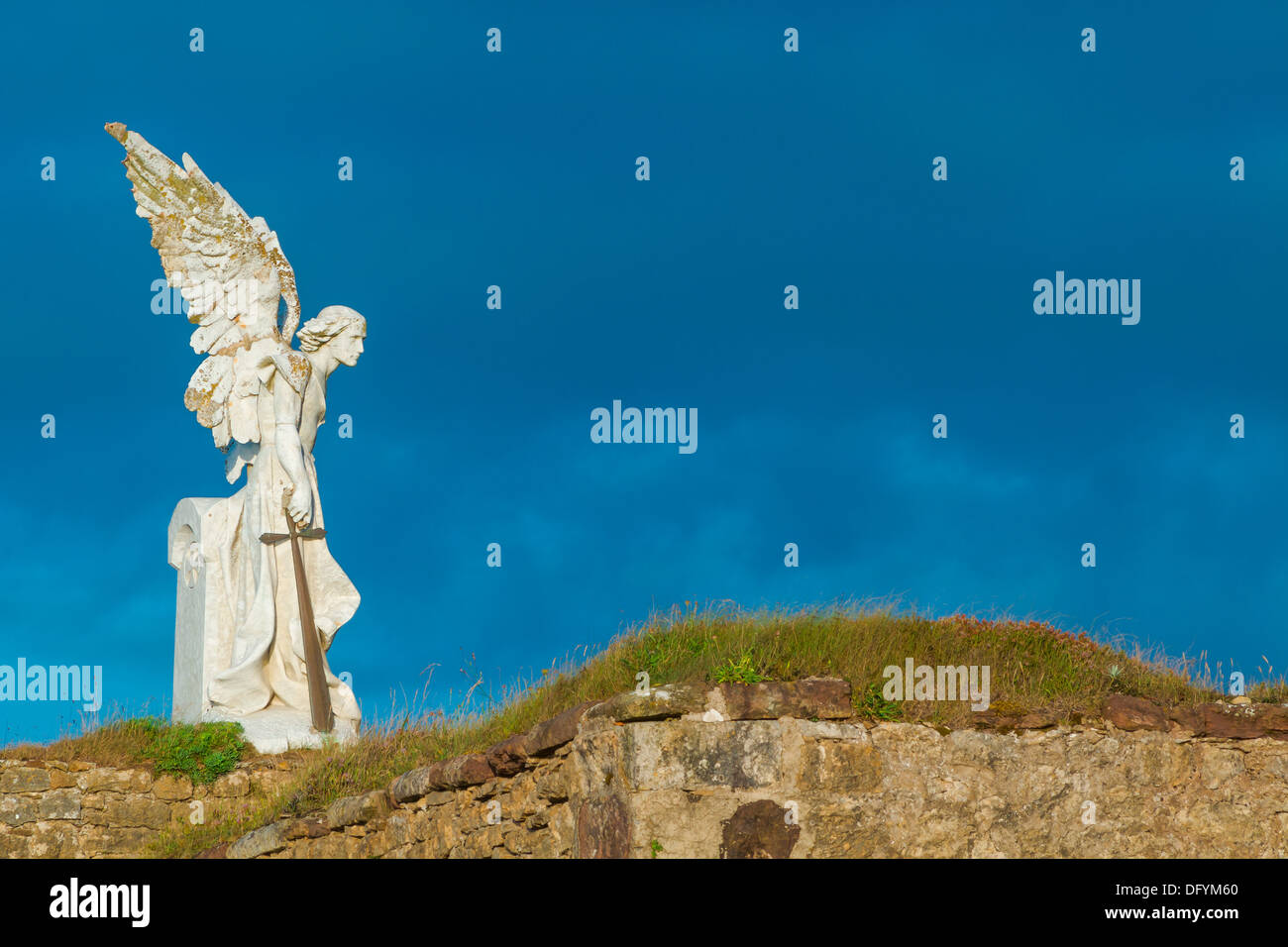 Lateral view of a statue of an angel made of stone from a cemetery ...