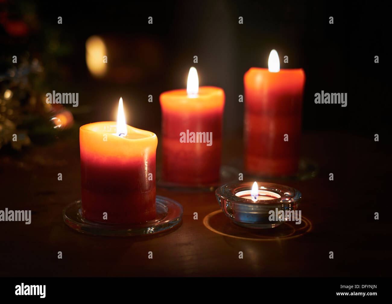 A Christmas tree scene at night with lit candles and Xmas decoration ...