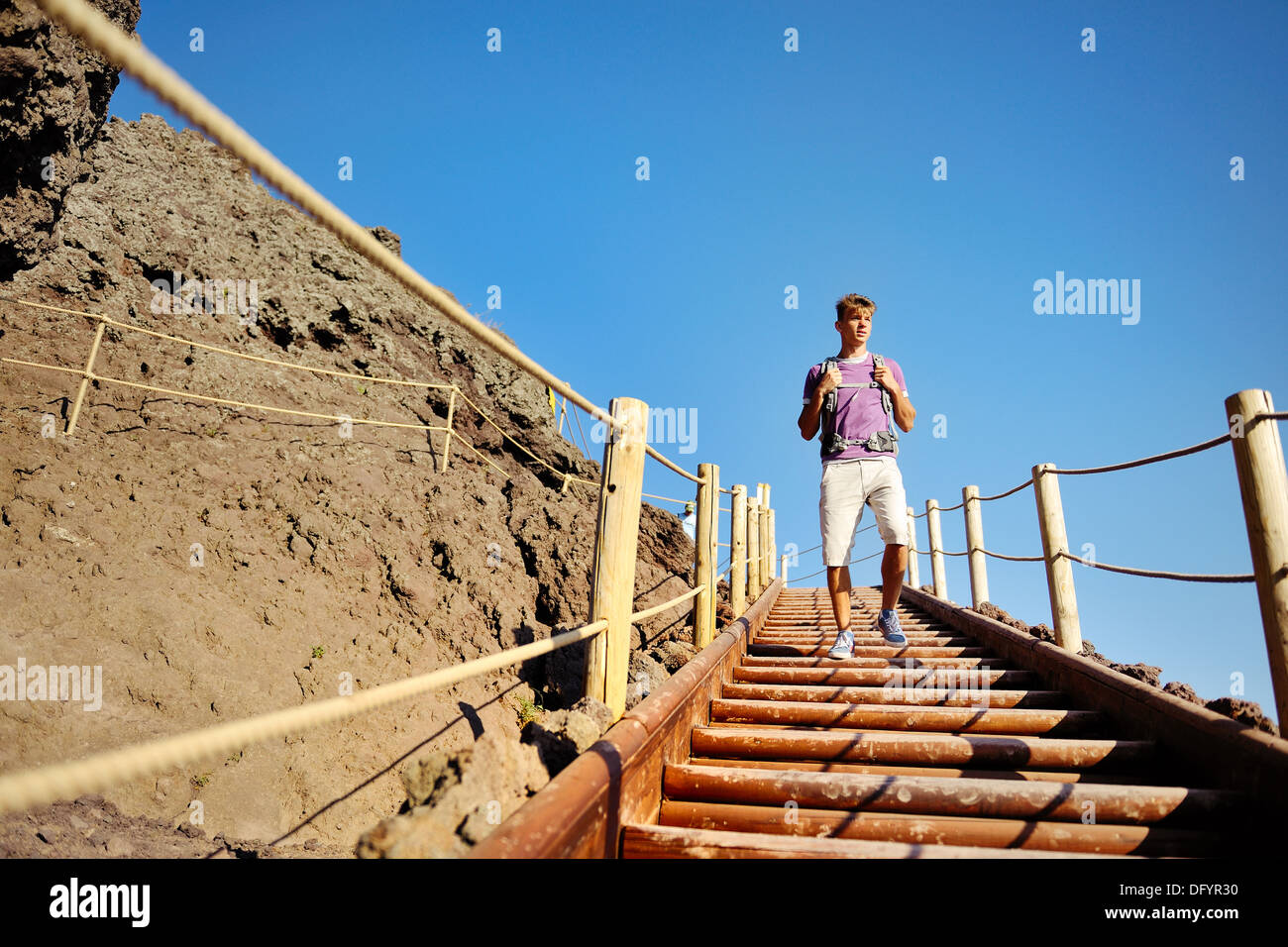 Young man climbing along hi-res stock photography and images - Alamy
