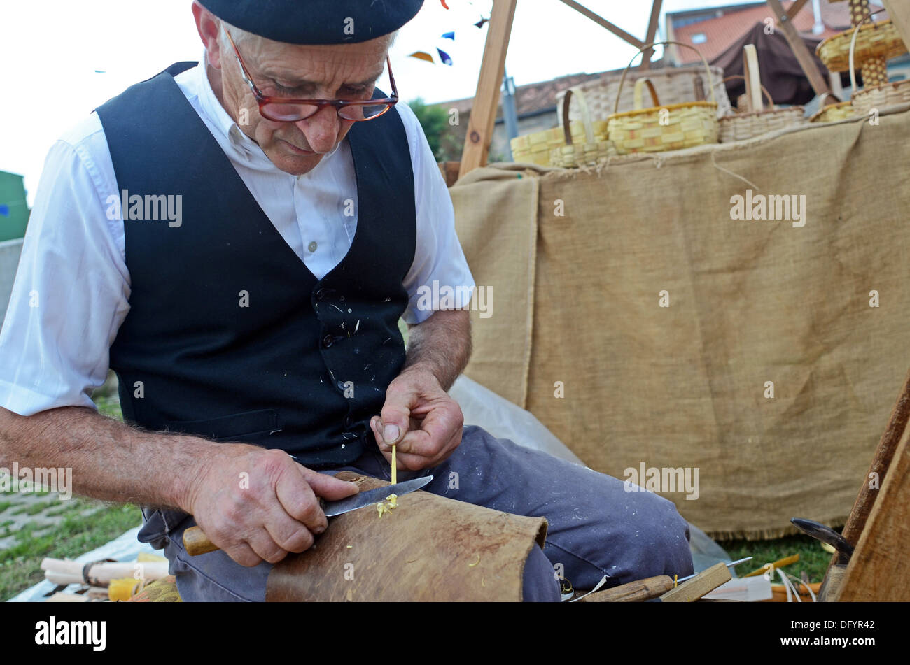 Elderly man makes handmade baskets during Asturias Day Stock Photo - Alamy