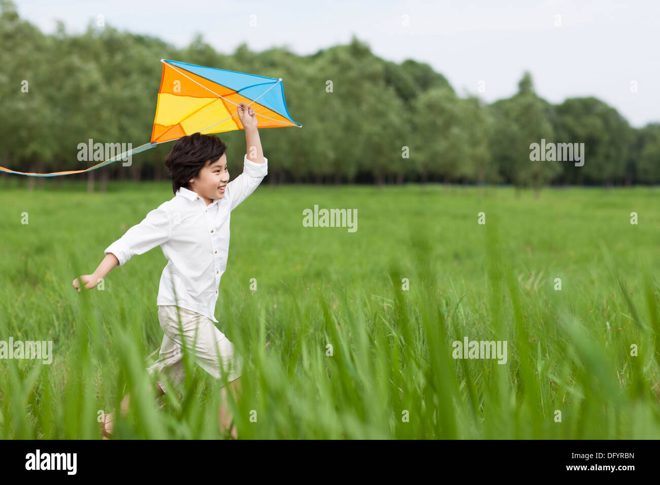 Boy flying paper airplane hi-res stock photography and images - Alamy