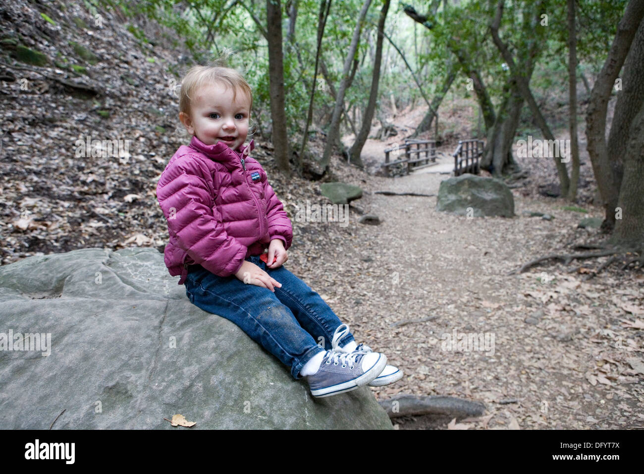 Cute Toddler Girl on a rock Stock Photo - Alamy