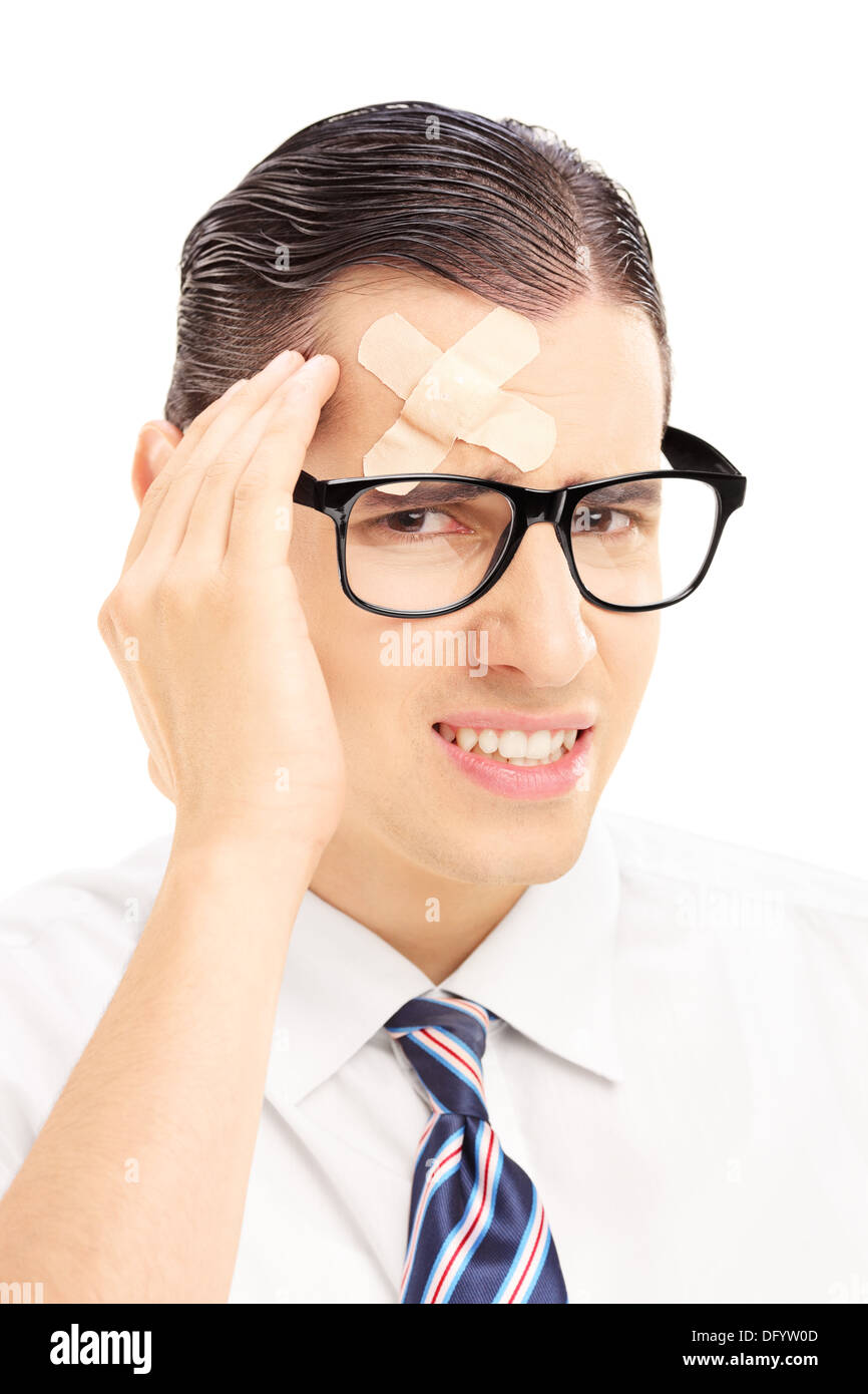 Serious young man with plaster on his forehead having a headache Stock ...