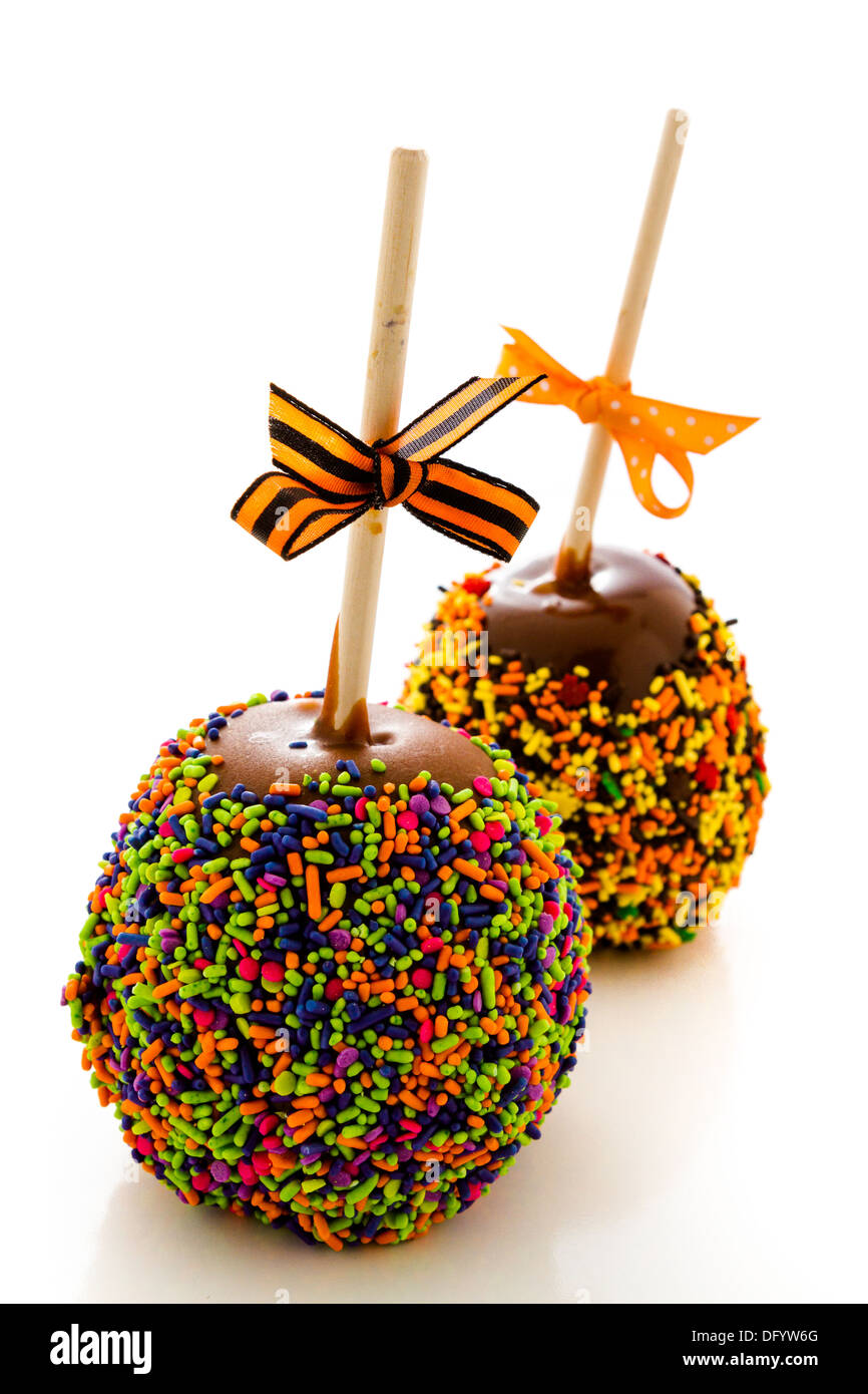 Hand dipped caramel apple covered with multi color sprinkles Stock ...