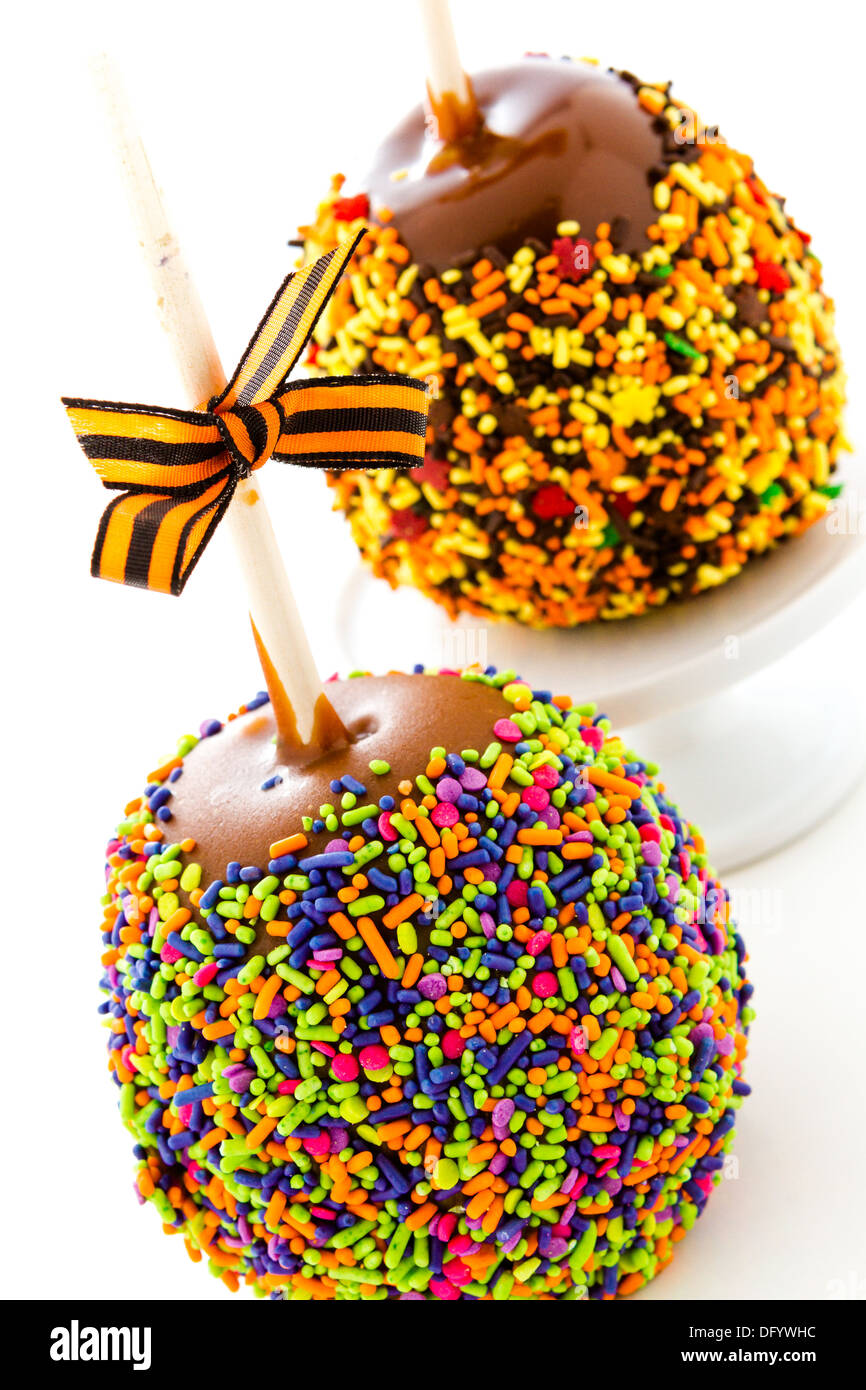 Hand dipped caramel apple covered with multi color sprinkles Stock ...