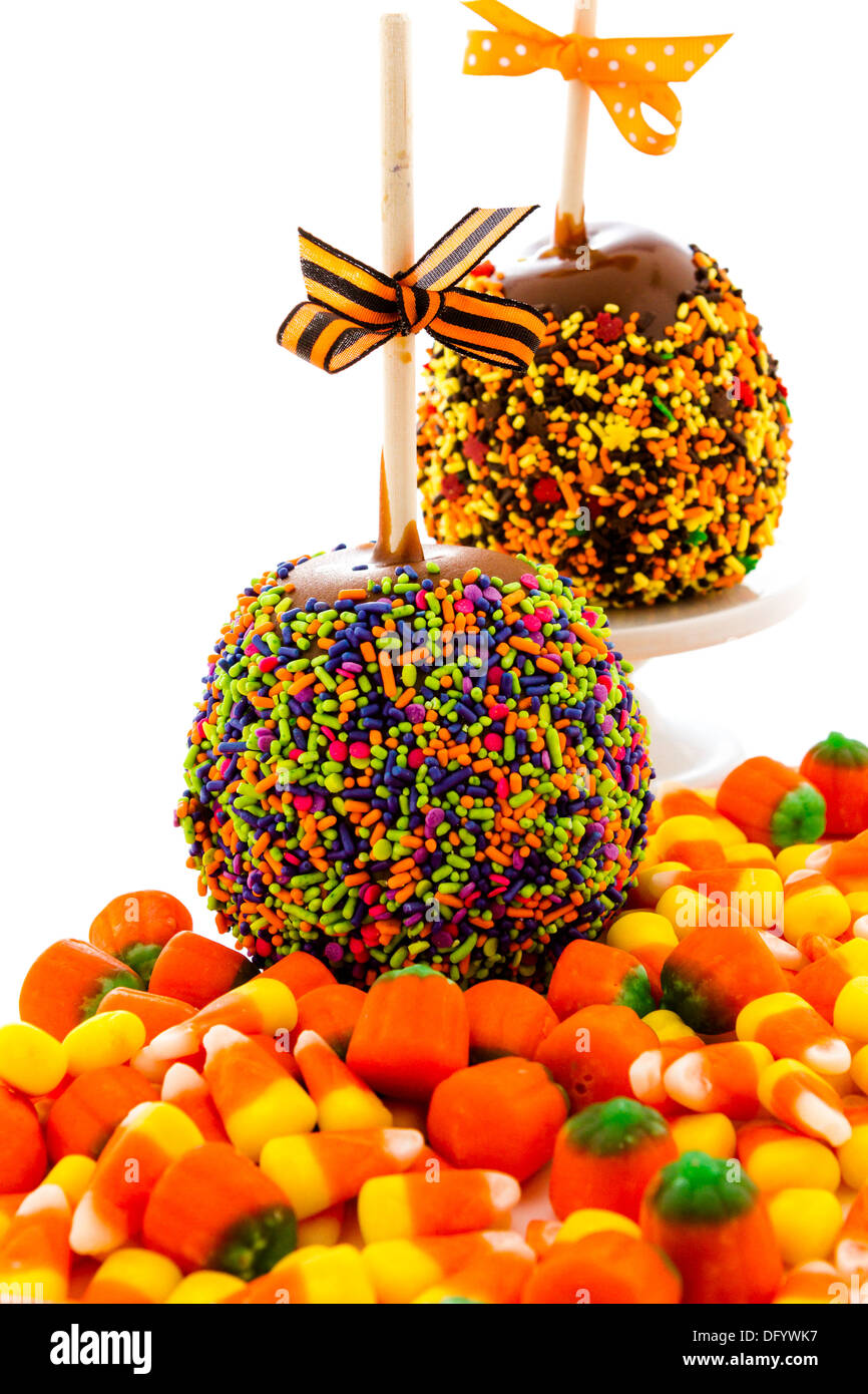 Hand dipped caramel apple covered with multi color sprinkles Stock ...