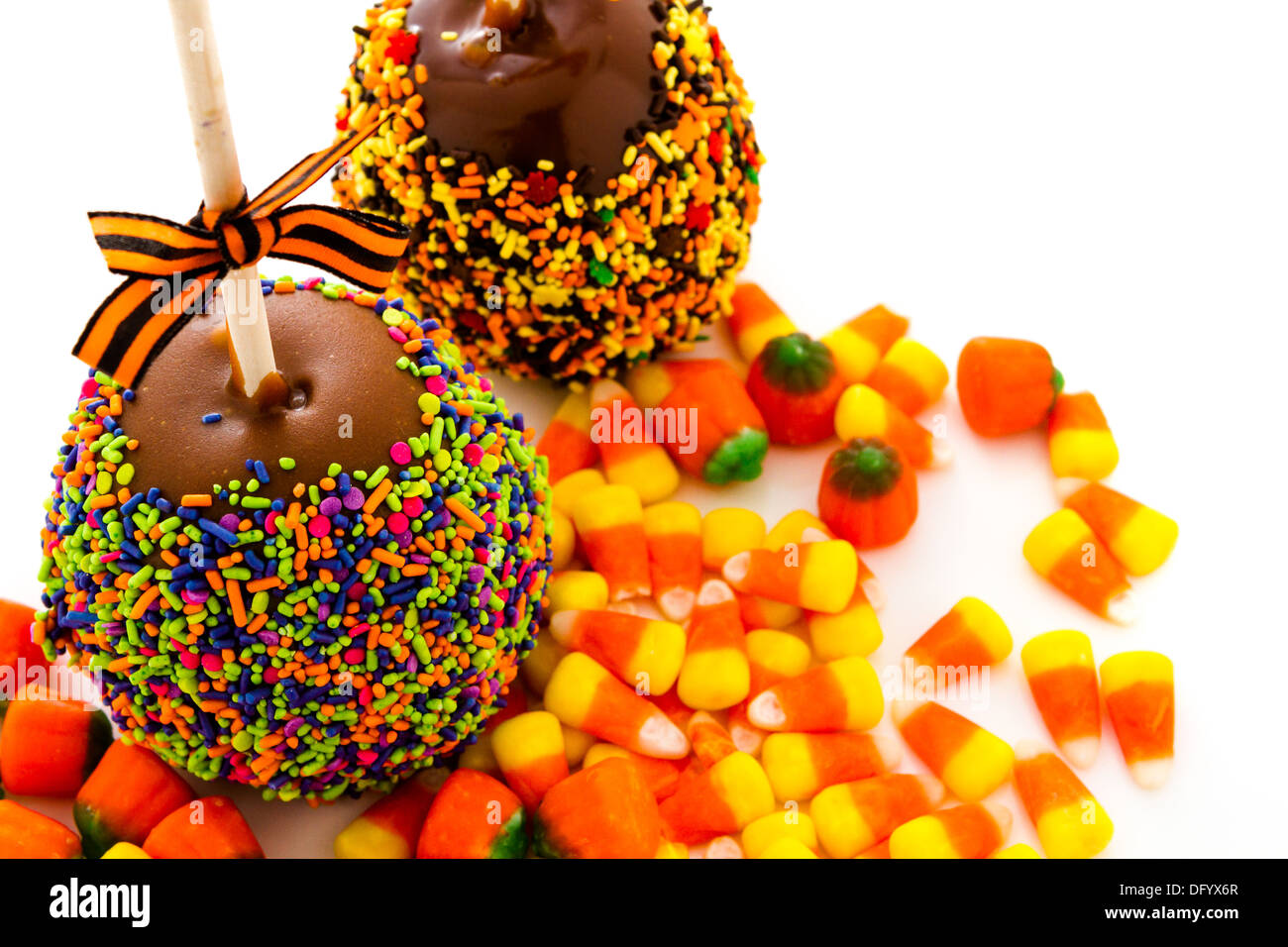 Hand dipped caramel apple covered with multi color sprinkles Stock ...