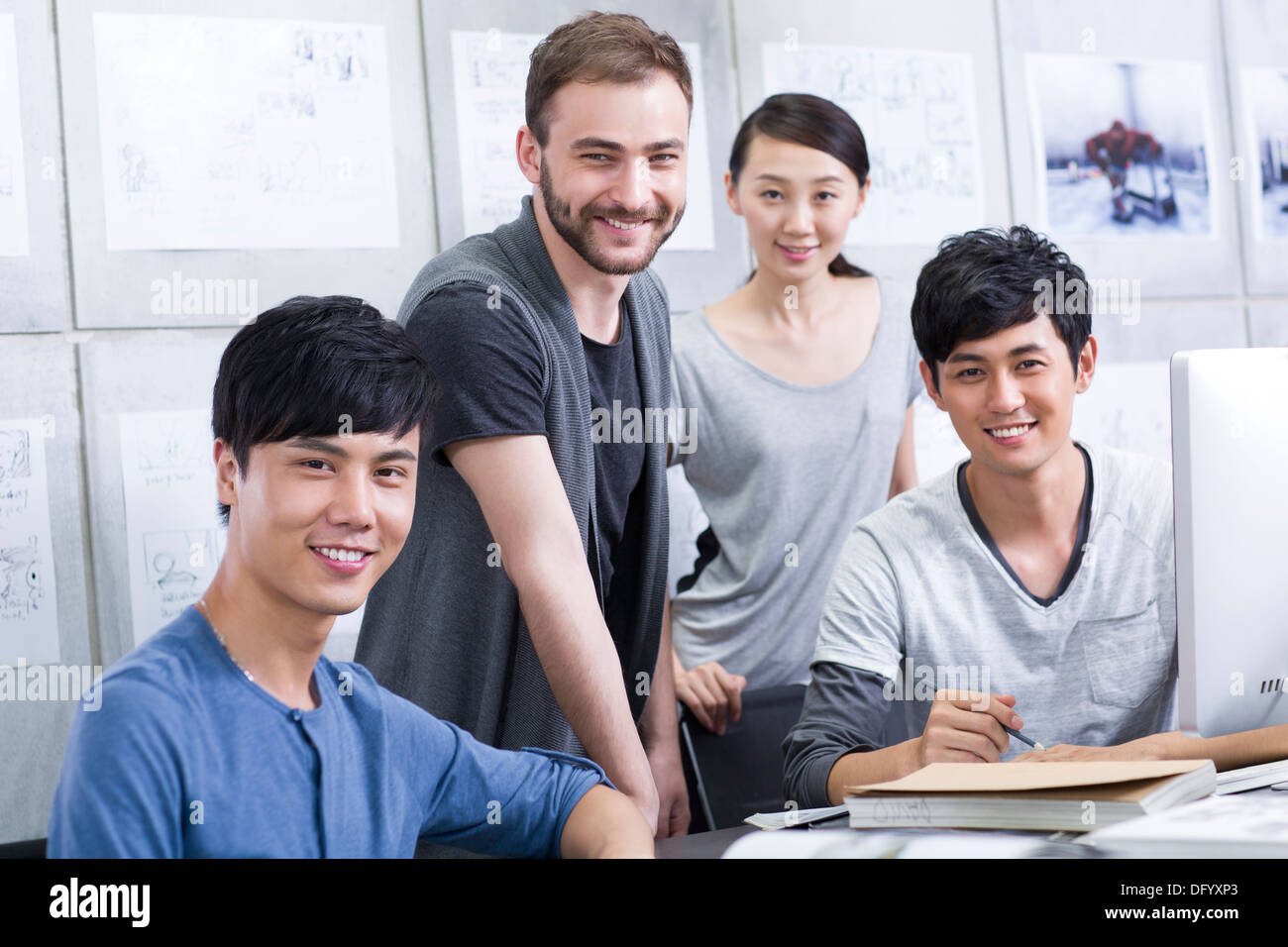 Young adults working in office Stock Photo: 61464651 - Alamy