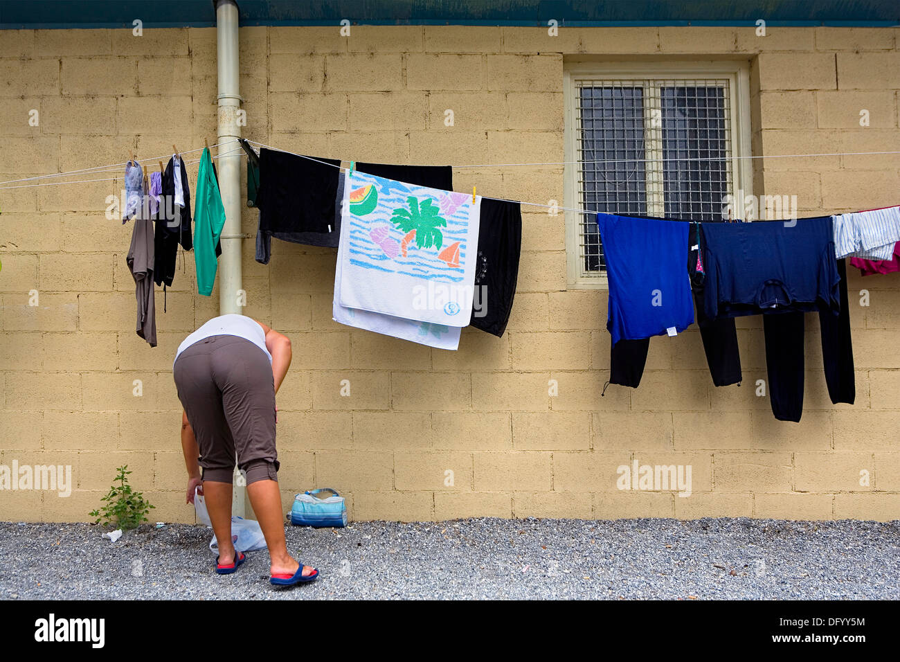 Pilgrim hanging clothes on washing line in PilgrimÂ´s hostel. Zubiri ...