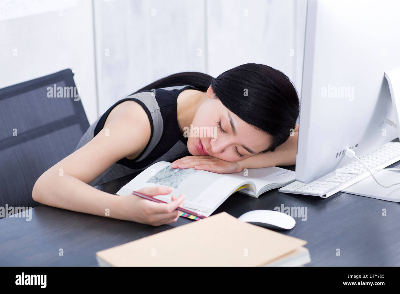 Creative young woman sleeping working hi-res stock photography and ...
