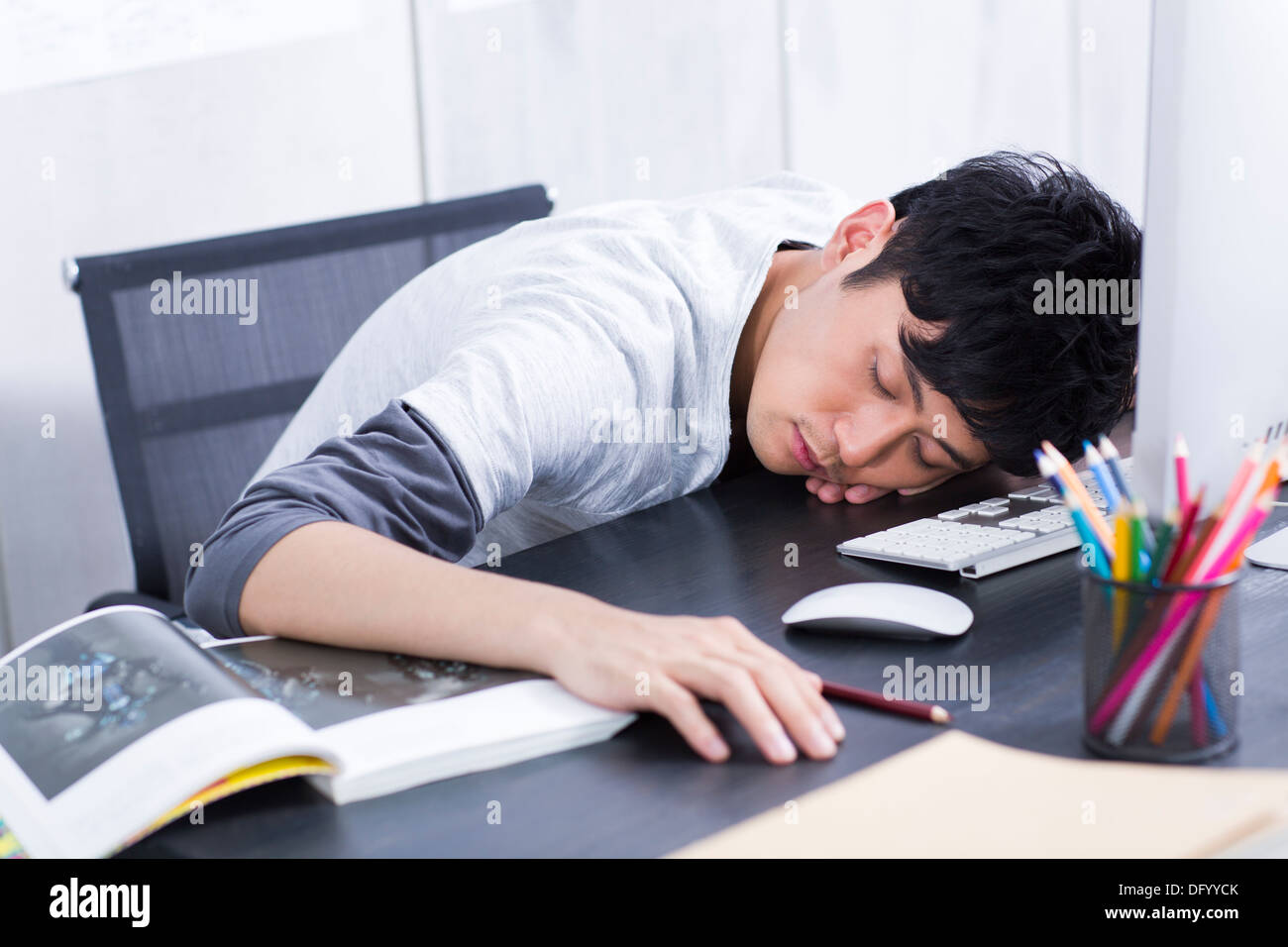 Asian man sleeping in chair hi-res stock photography and images - Alamy