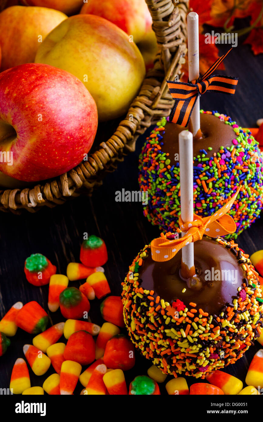 Hand dipped caramel apple covered with multi color sprinkles Stock ...