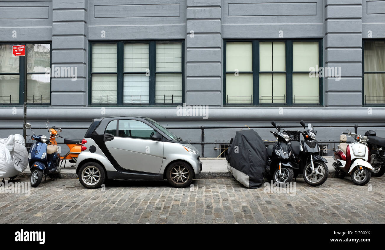 Smart Fortwo car parked amid row of motorcyles and scooters, Brooklyn ...