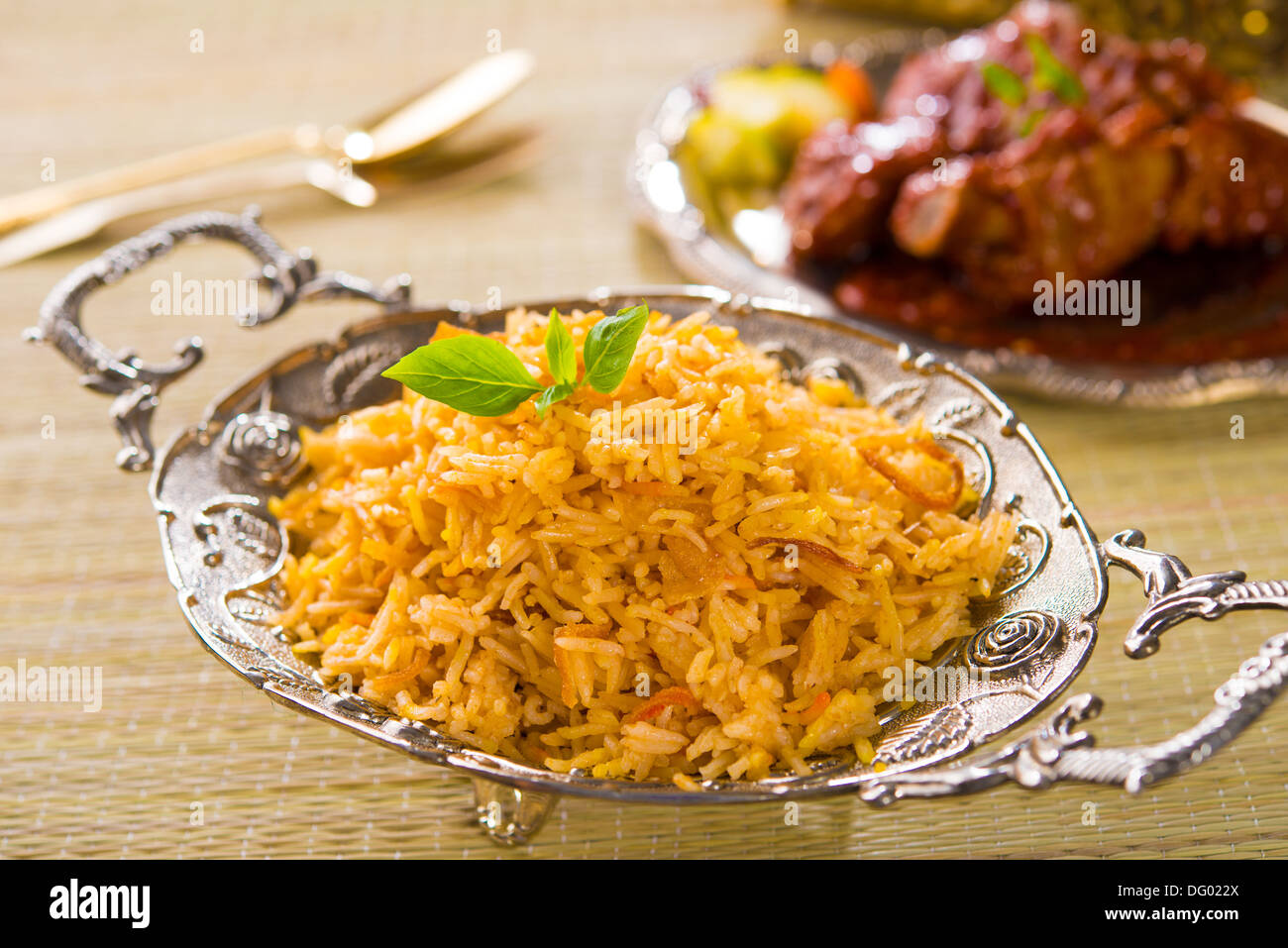 Biryani rice or briyani rice, curry chicken and salad, traditional ...