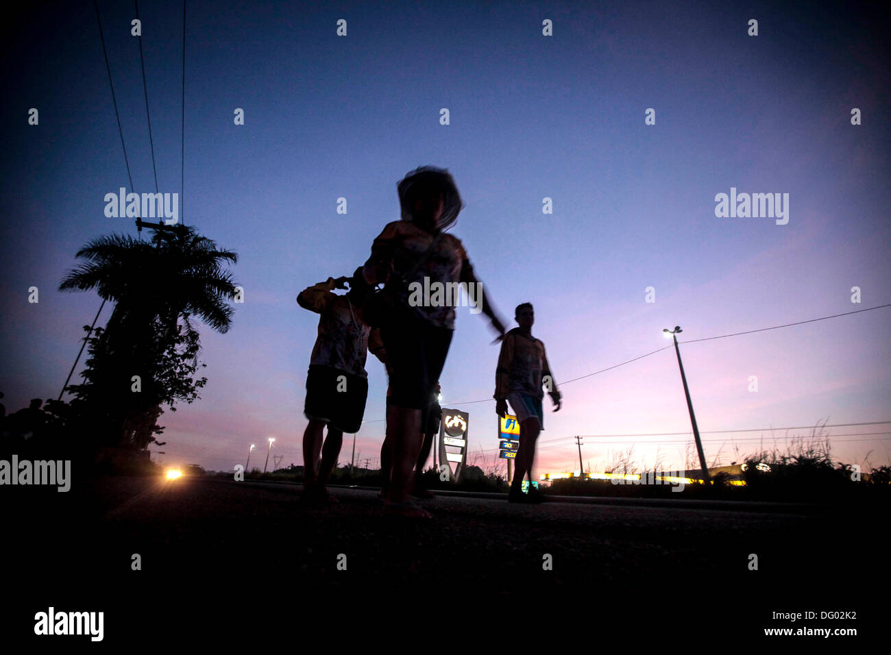 Pilgrims walk through BR-316 towards the Basilica of Nazare in Belem ...