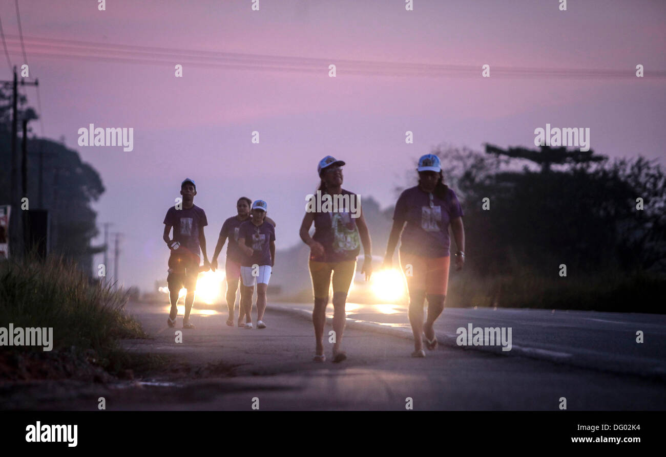 Pilgrims walk through BR-316 towards the Basilica of Nazare in Belem ...
