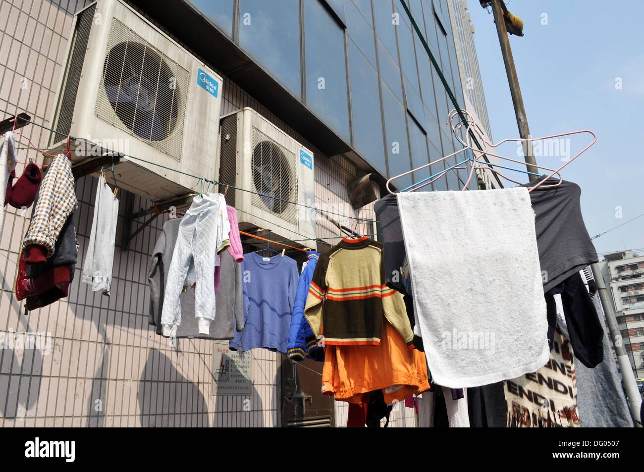Shanghai (China): laundry put out to dry by some air conditioning boxes ...