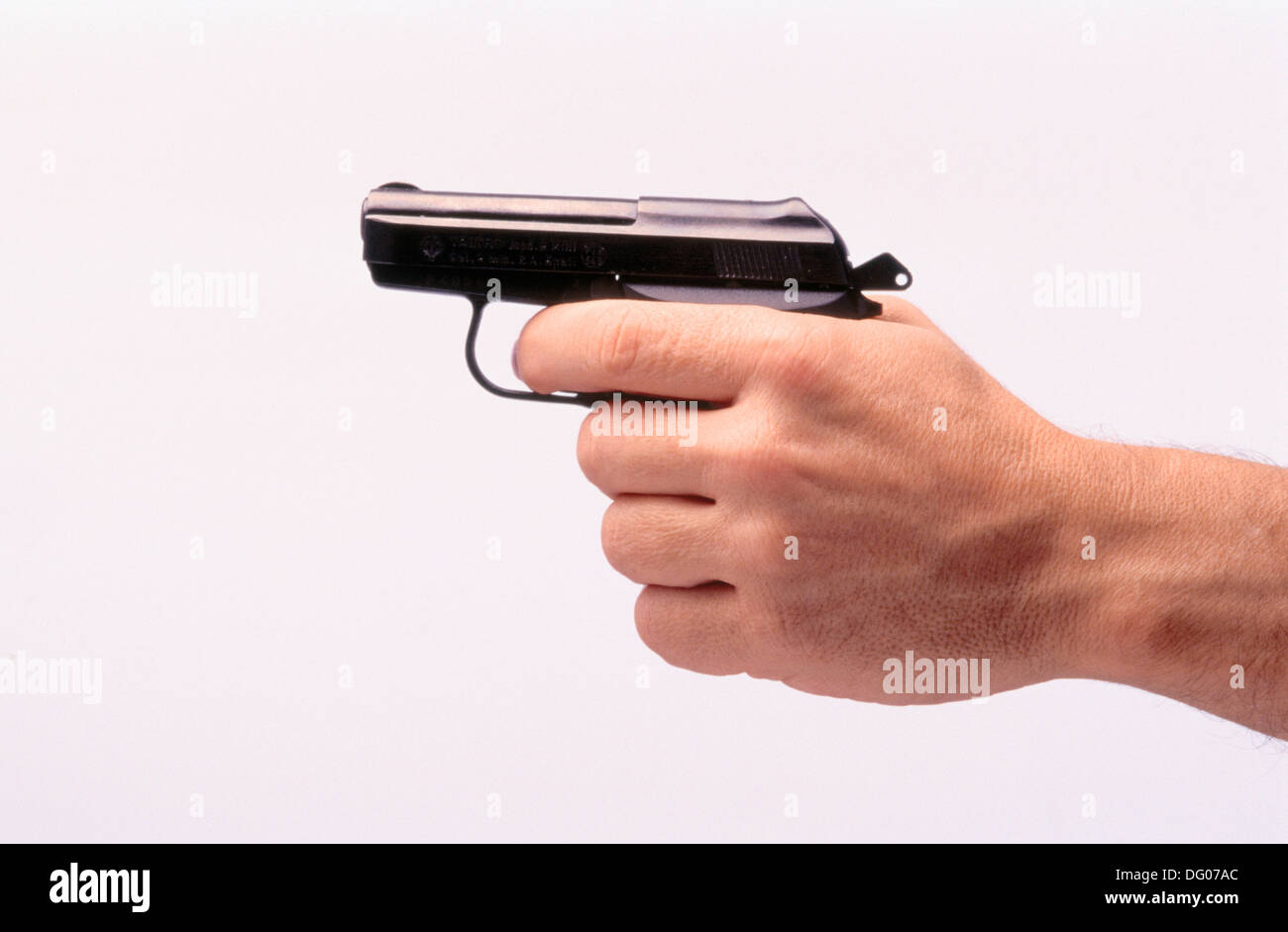 Hand holding gun profile hi-res stock photography and images - Alamy