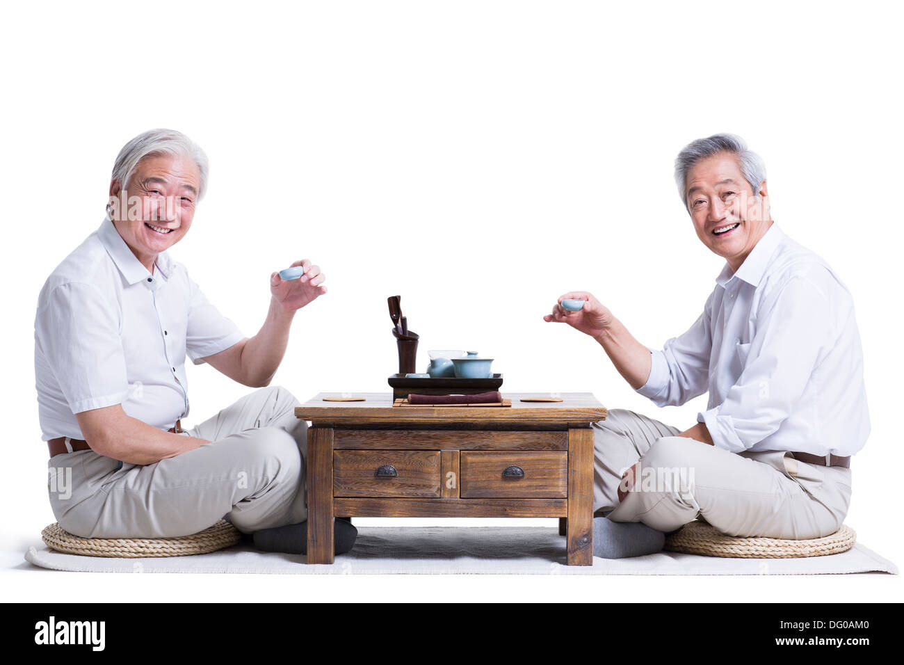 Two young men friends sitting Cut Out Stock Images & Pictures - Alamy