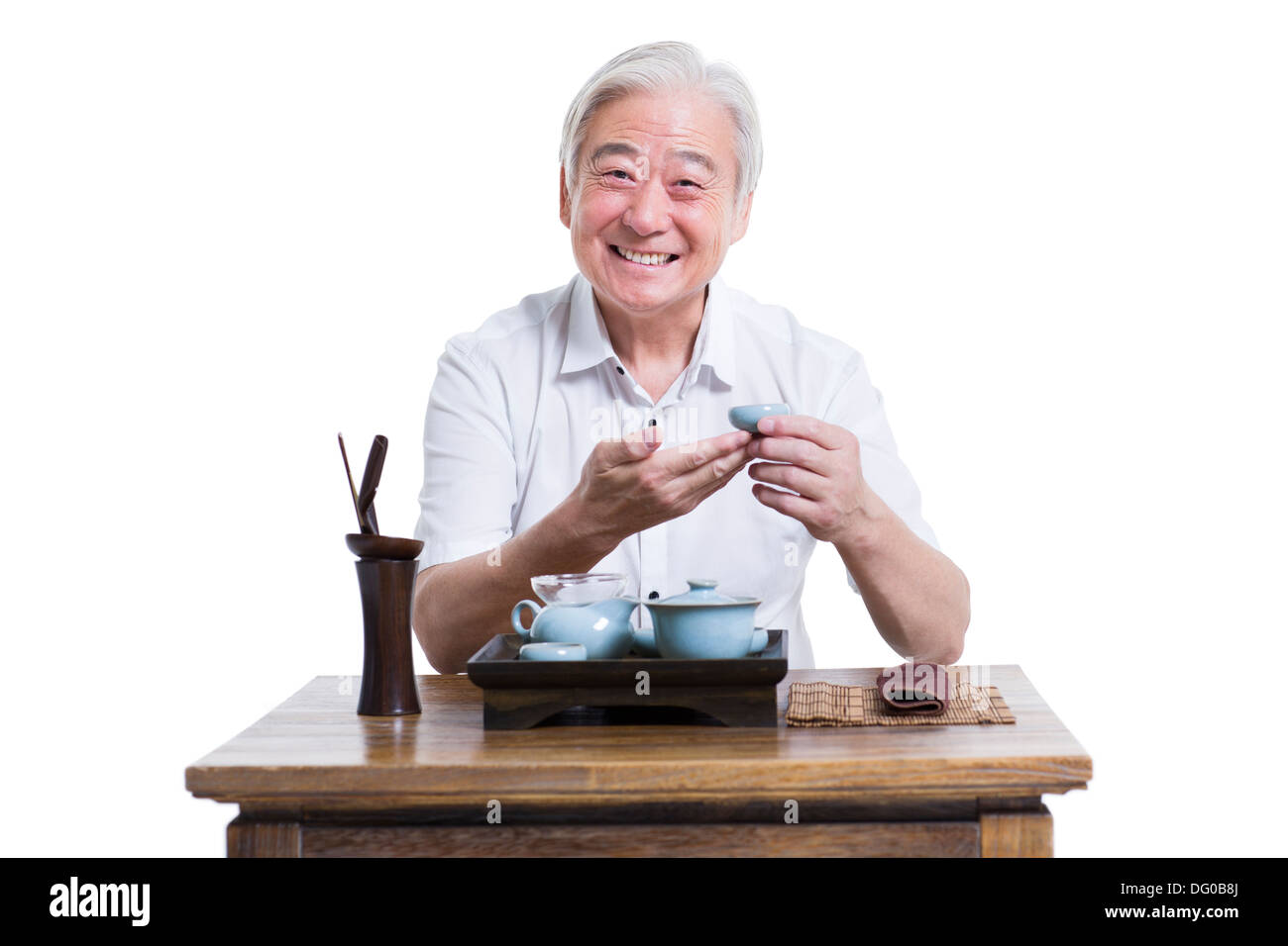 Happy senior man having tea Stock Photo - Alamy