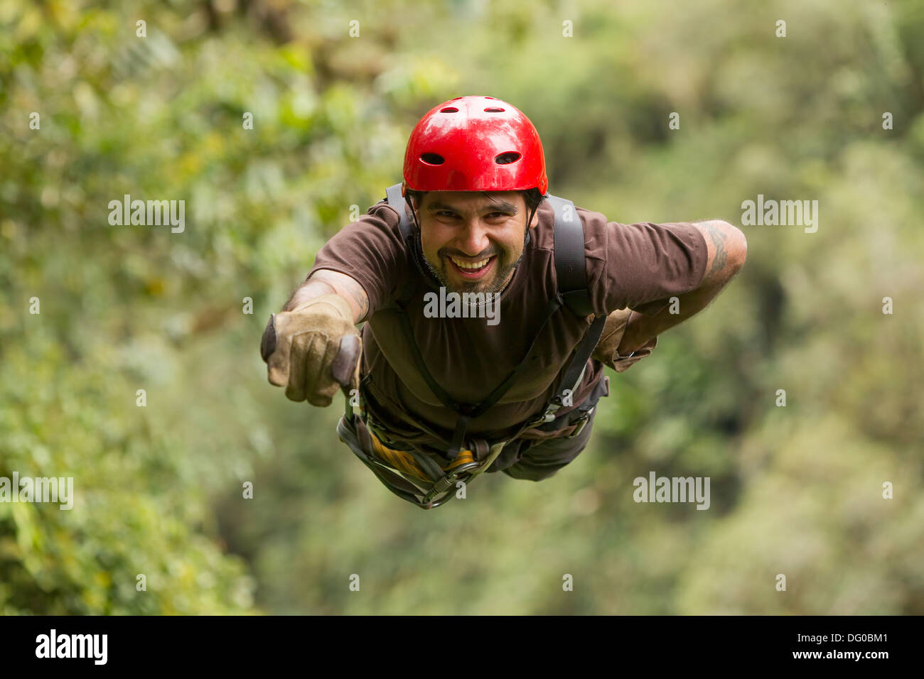 ZIP LINE ZIPLINE ADVENTURE IN ECUADORIAN RAINFOREST BANOS Stock Photo ...