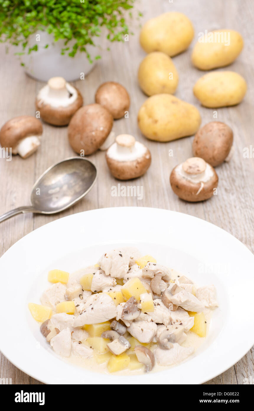 Fricassee from turkey with potatoes and mushrooms Stock Photo - Alamy