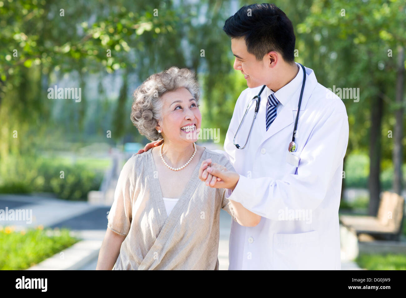 Doctor taking care of patient Stock Photo - Alamy