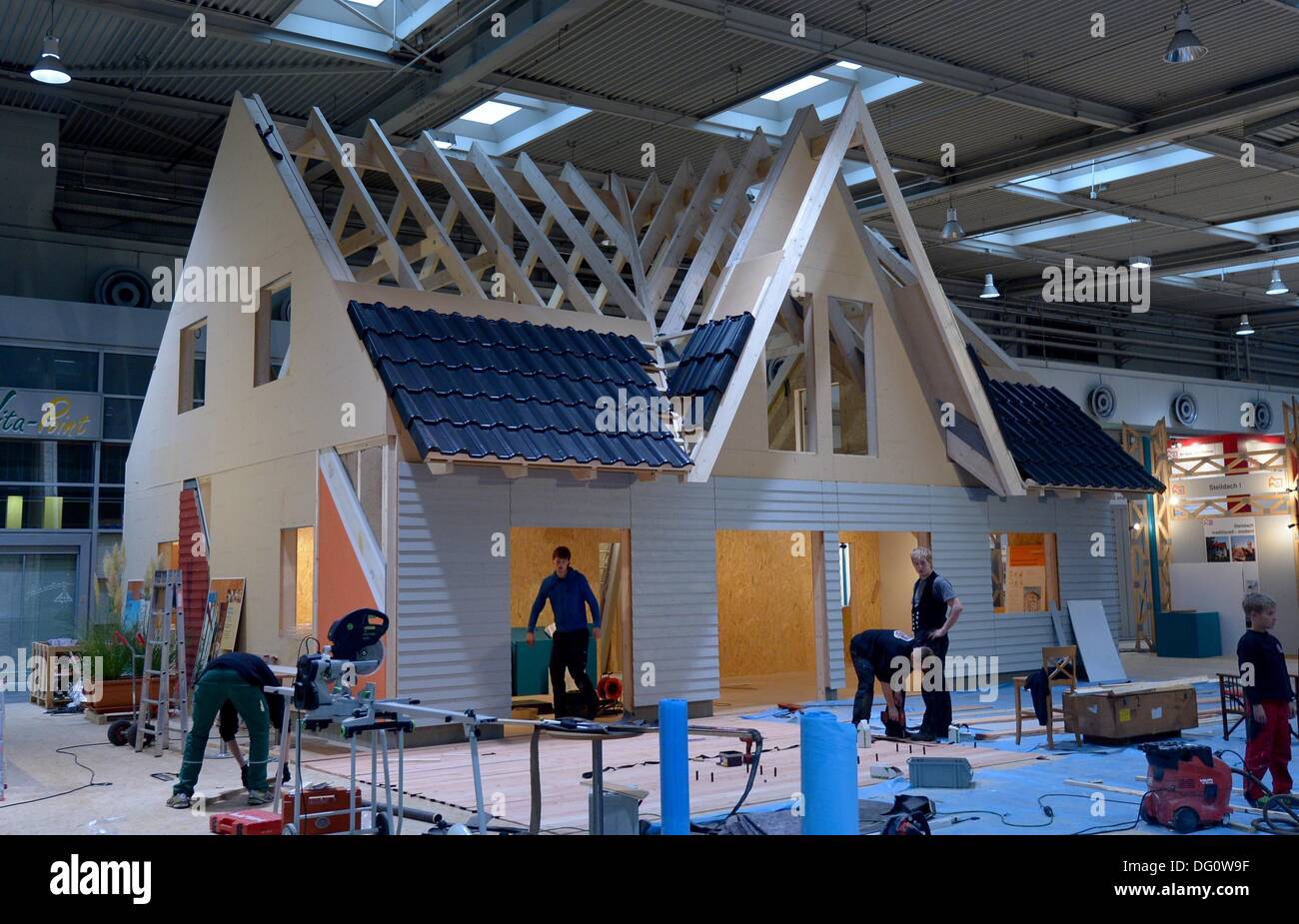 Hanover, Germany. 11th Oct, 2013. A house made of wood is constructed ...