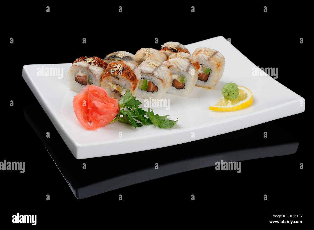 Eight rolls with smoked eel on black background Stock Photo - Alamy