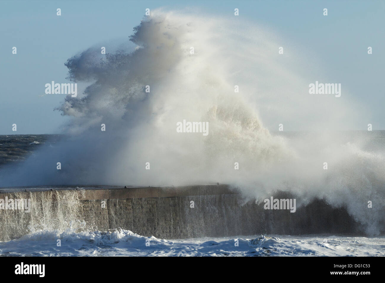 Waves crashing over harbour wall at Seaham, County Durham on the north ...