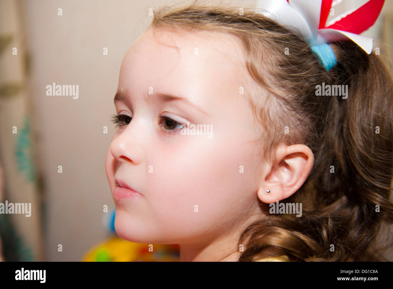 Girl with hair ribbon close up Stock Photo - Alamy