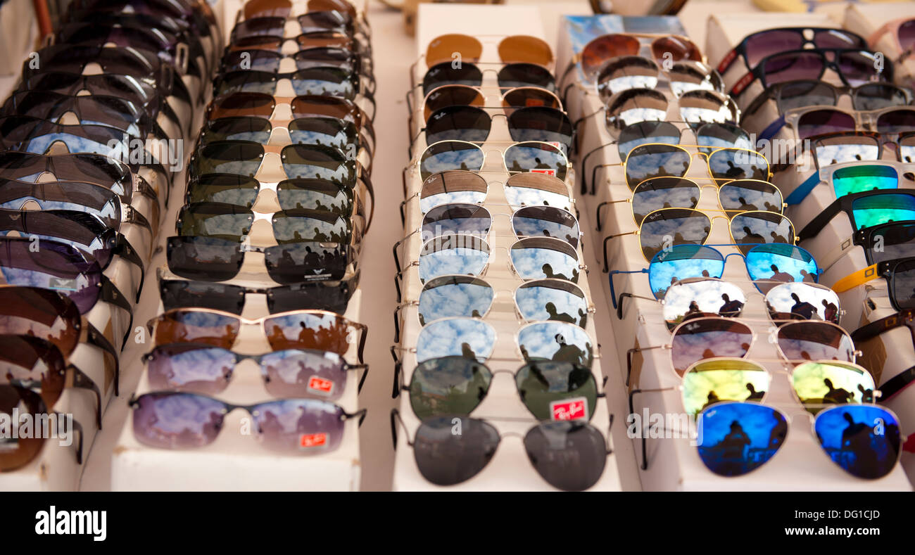 Rows of sunglasses for sale at market stall Stock Photo - Alamy