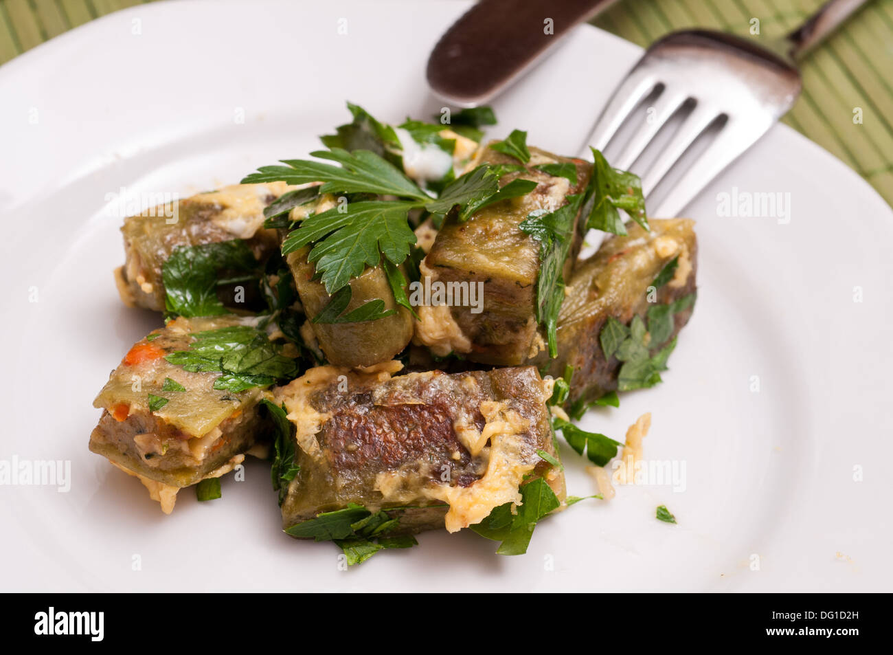 Plate with egg fried swabian pockets and parsley Stock Photo - Alamy