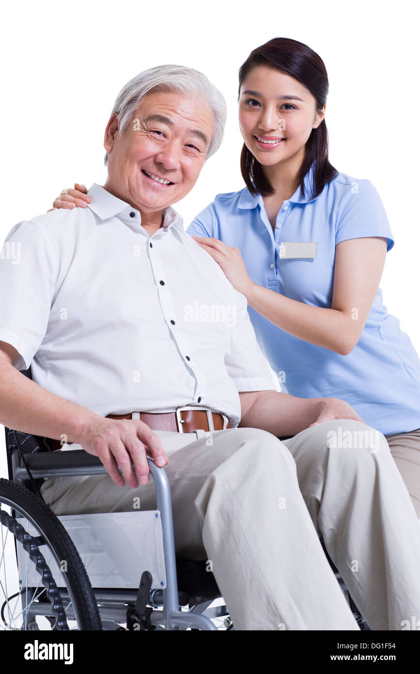 Female nursing worker and senior man Stock Photo - Alamy