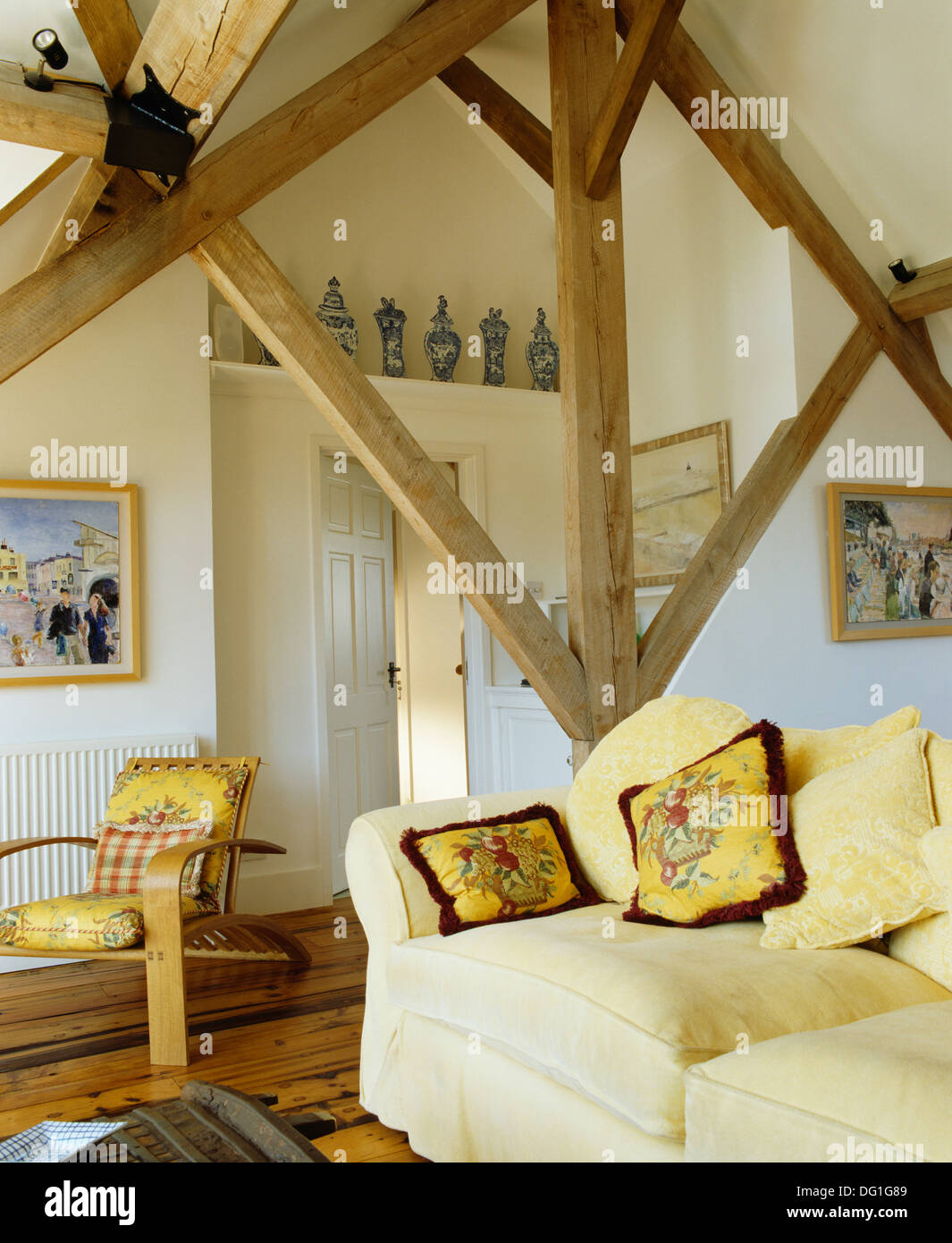 Rustic wooden beams and apex ceiling in country living room with ...