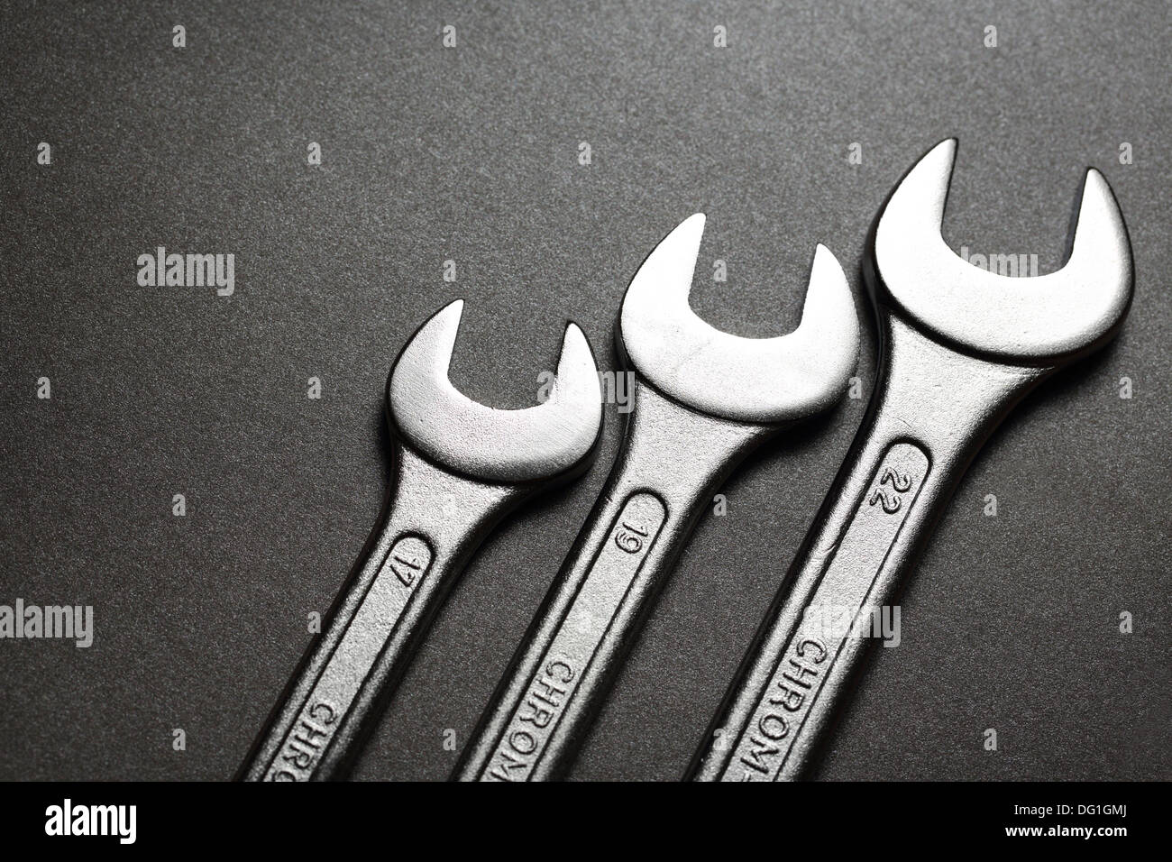Screw keys on black background Stock Photo - Alamy