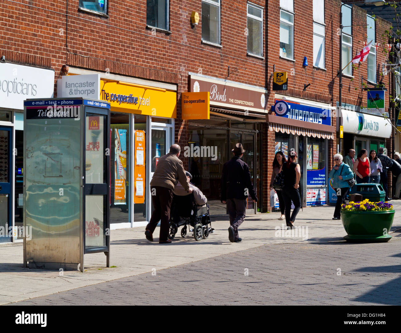 Shoppers in a pedestrianised high street in Belper Derbyshire England ...