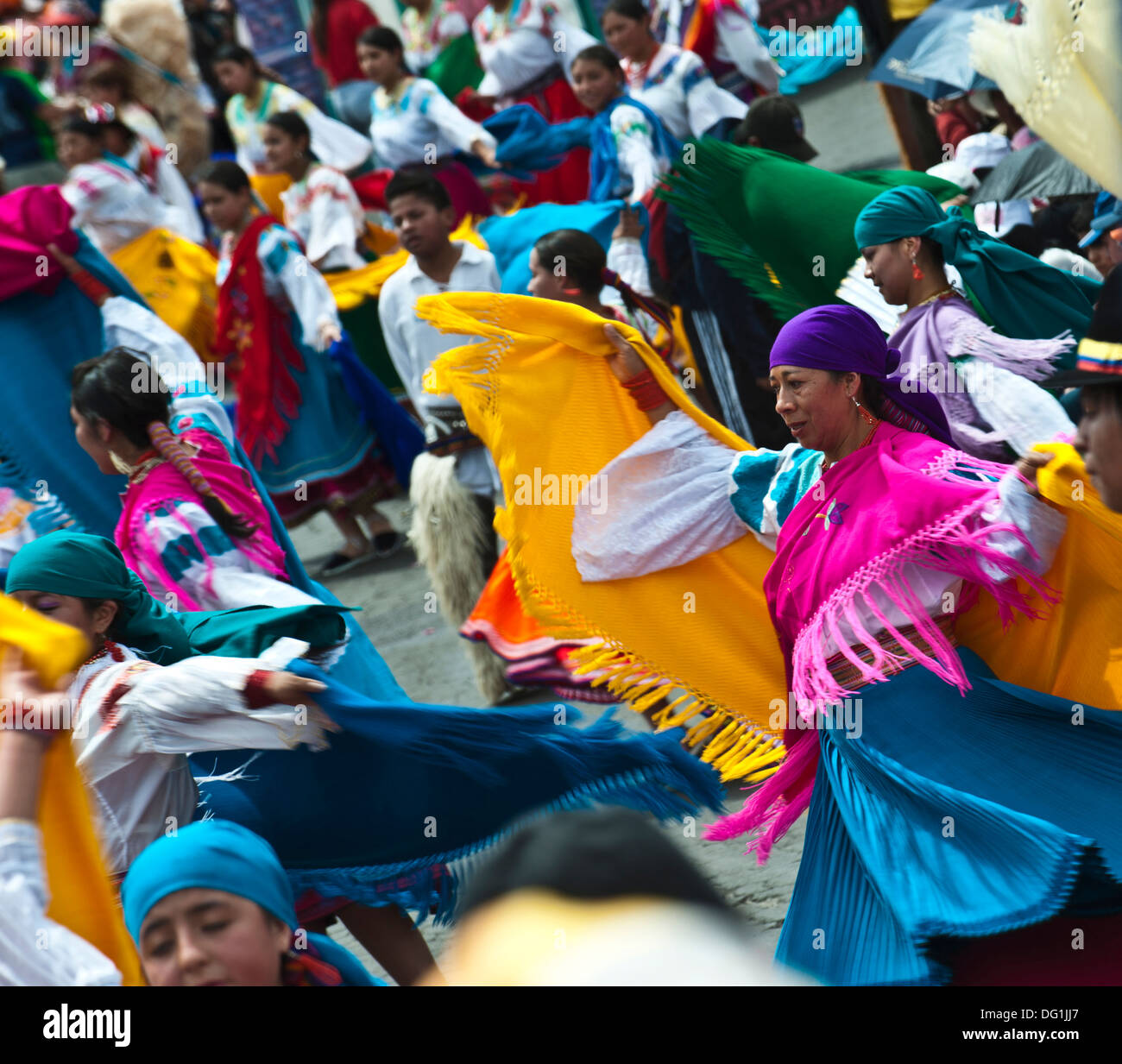 People in traditional Ecuadorean dresses dance as part of a parade ...