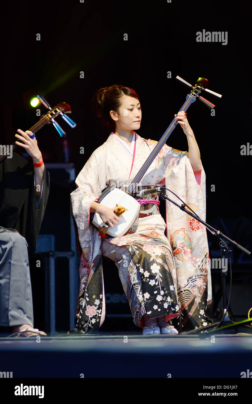 Japanese traditional musician playing tsugaru shamisen live on stage at ...