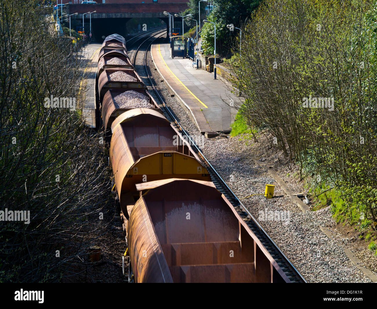 View looking down on goods train carrying freight including quarry ...