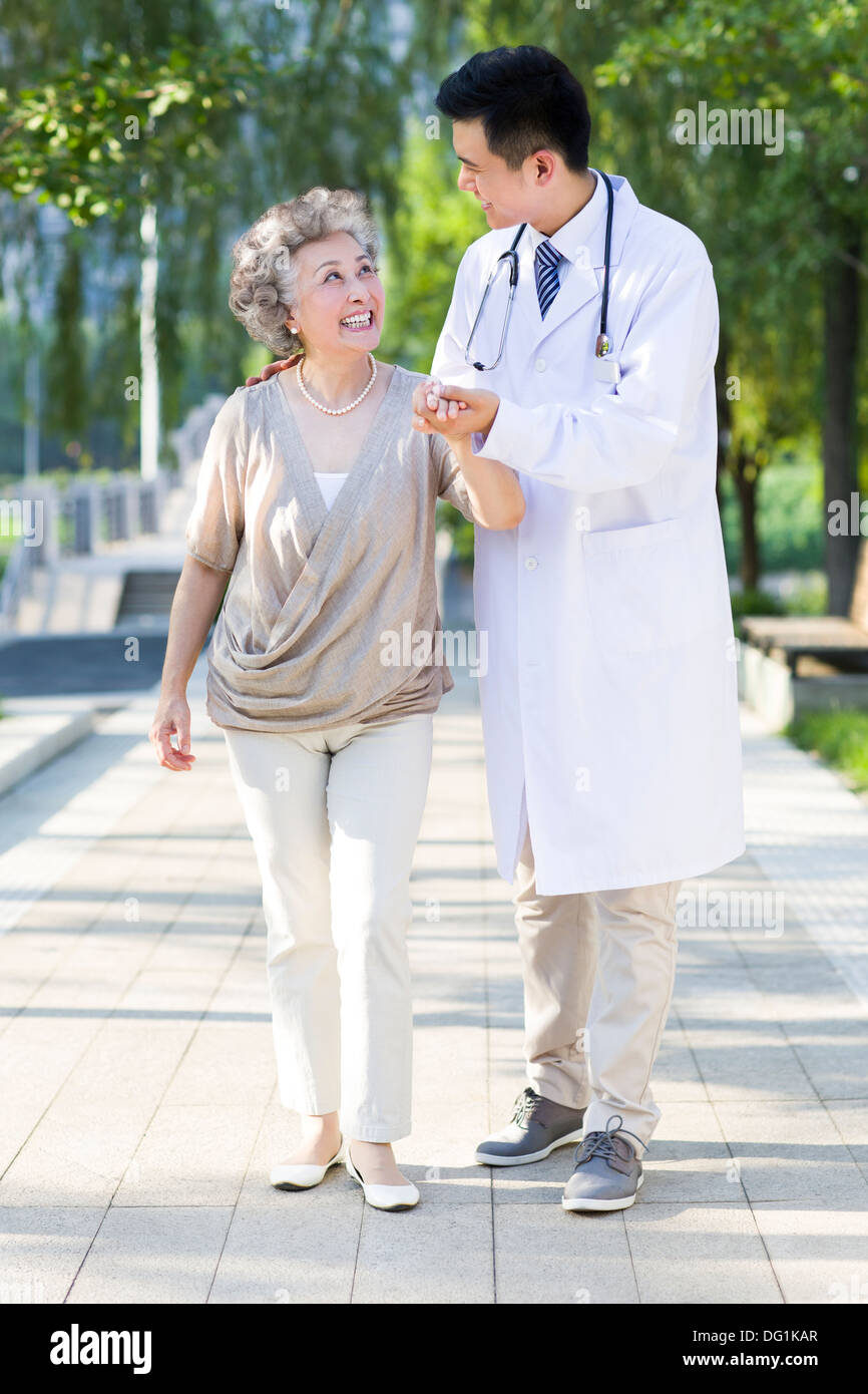 Doctor taking care of patient Stock Photo - Alamy